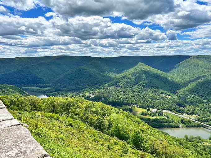 Rolling green mountains meet winding river in a view that'll make your heart skip a beat.