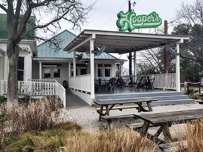 That vintage green sign beckons like a siren call, promising horror-themed fun and seriously good eats ahead.