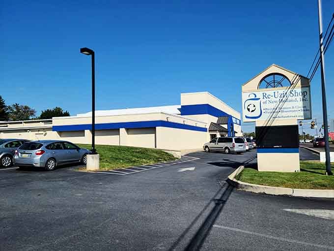 A modern building with bold blue stripes stands proudly, its distinctive architecture catching the eye like a nautical flag against the clear sky.