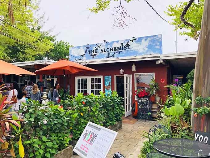 Lush greenery frames the entrance like nature's own welcome mat, inviting you into this garden paradise.