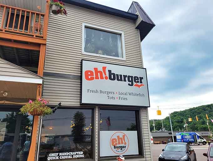 That bold red signage against the Upper Peninsula sky isn't just announcing a restaurant &ndash; it's declaring a burger revolution.