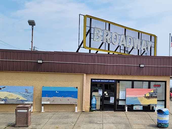 Those cheerful beach murals flanking the entrance promise exactly what's inside: coastal charm without coastal pricing.