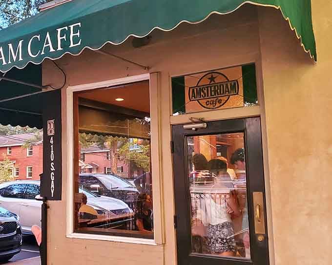 That green awning isn't just decoration, it's your first hint that something special awaits inside this Auburn treasure.