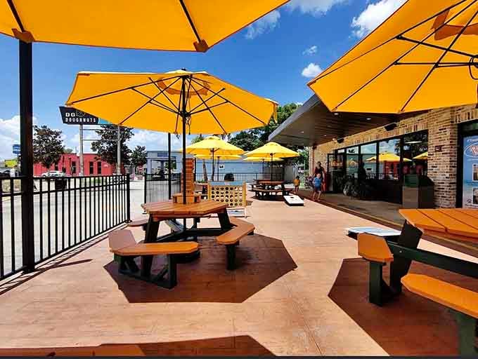 Sunshine, yellow umbrellas, and picnic tables waiting for you to demolish a doughnut the size of a hubcap.