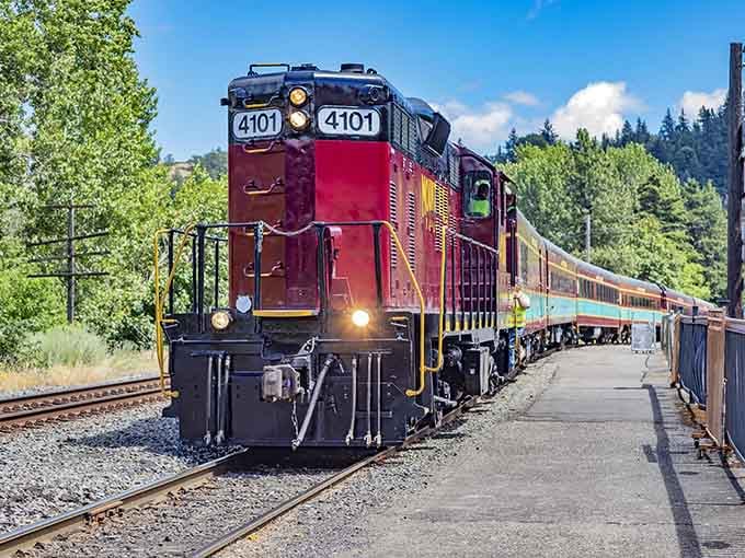 That burgundy beauty isn't just a locomotive, it's your ticket to remembering when getting there was half the fun.
