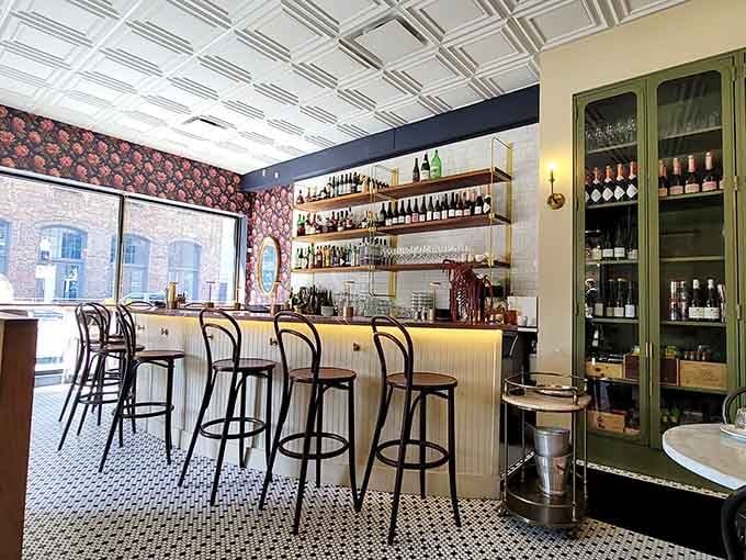 Bentwood chairs and floral wallpaper create a Parisian bistro vibe that'll make you check your passport.