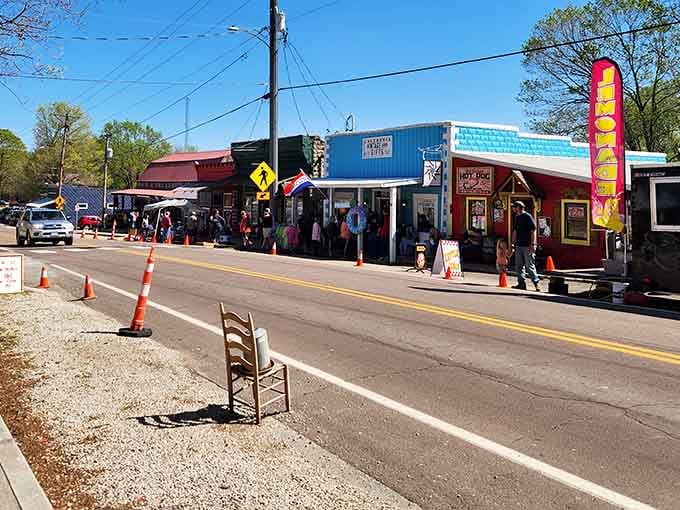 That lone chair in the street isn't art, it's a front-row seat to small-town charm at its finest.