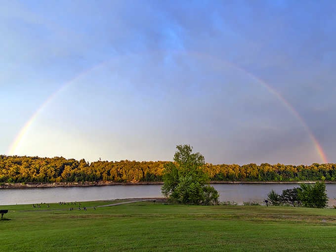 Mother Nature showing off with a full rainbow arc over the lake, proving she's still got it.