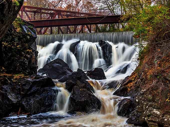 Water cascading over ancient rocks like nature's own staircase, proving Connecticut does drama beautifully.