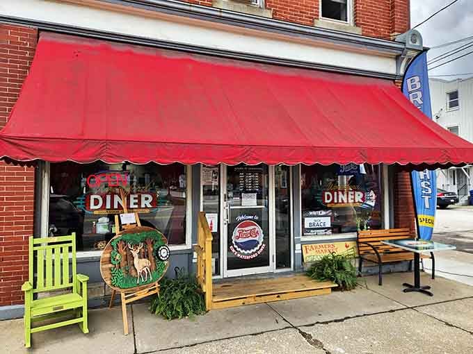 That red awning isn't just decoration; it's a beacon calling you home to breakfast, lunch, and pure diner happiness.