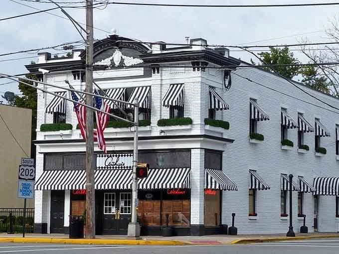 Those classic striped awnings and corner architecture whisper "come in, we've been waiting for you since forever."
