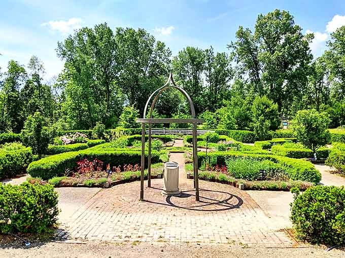 That elegant archway isn't just garden decoration, it's your portal to forgetting Michigan winter ever existed.
