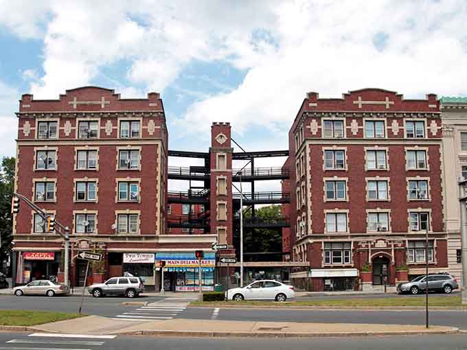 Historic brick buildings line the streets where Waterbury's industrial glory days still echo through every architectural detail.