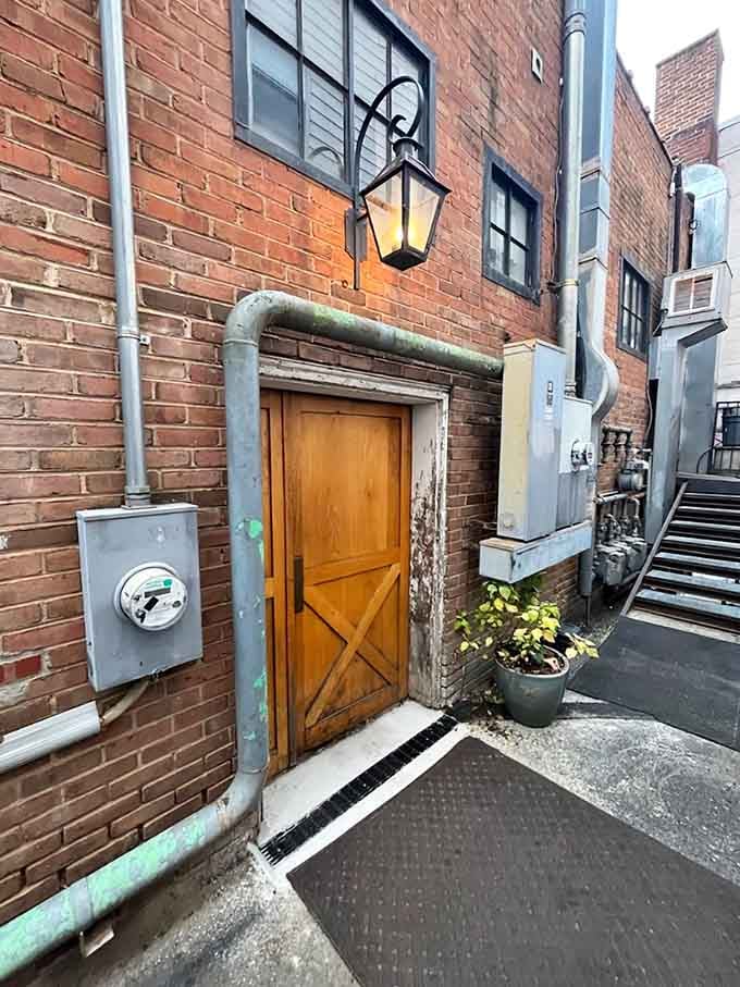 That wooden door in the brick alley? It's your portal to culinary magic, hiding in plain sight.