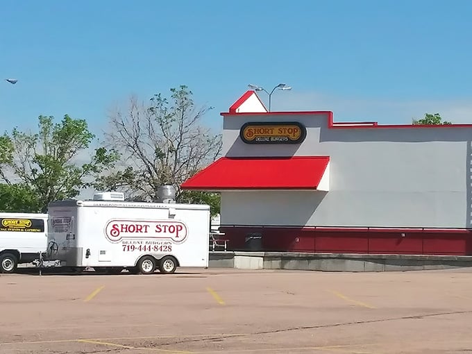 That red roof isn't just architecture, it's a beacon calling hungry souls to burger paradise in Colorado Springs.