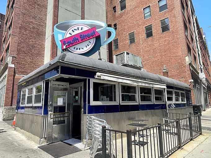 Vintage diner crowned with a coffee cup big enough to caffeinate the entire neighborhood—now that's truth in advertising.