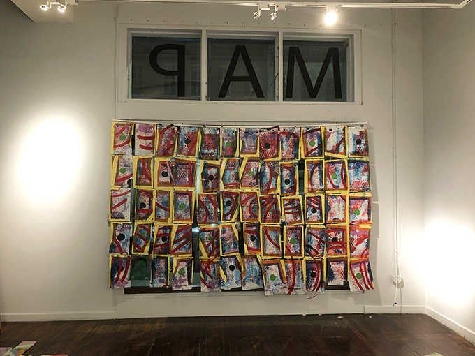 Abstract chaos meets methodical madness in a grid that somehow makes perfect sense while making no sense at all.