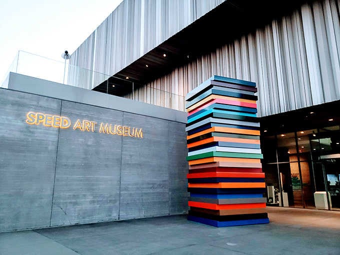The colorful stacked sculpture greets visitors like a cheerful beacon saying "Yes, art can be this fun!"