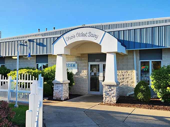 The charming entrance to Toft Dairy Ice Cream Parlor welcomes visitors with classic architecture and pristine landscaping.