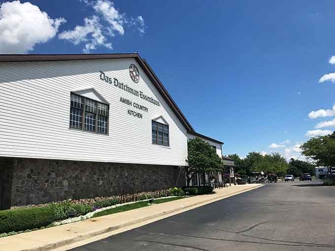 The stone foundation and pristine white siding tell you everything: this place respects tradition while welcoming hungry travelers with open arms.