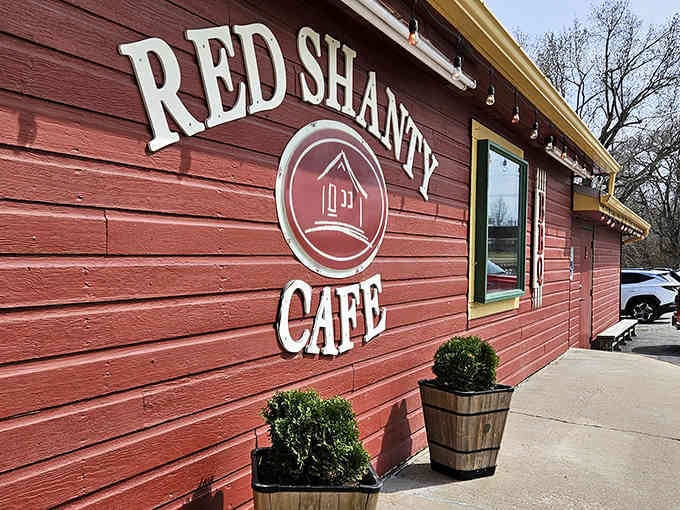 That bold red exterior isn't just eye-catching, it's a beacon calling hungry travelers off the highway to barbecue bliss.