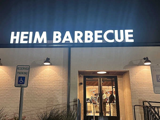 That glowing sign isn't just advertising, it's a beacon of hope for anyone within driving distance of smoked perfection.