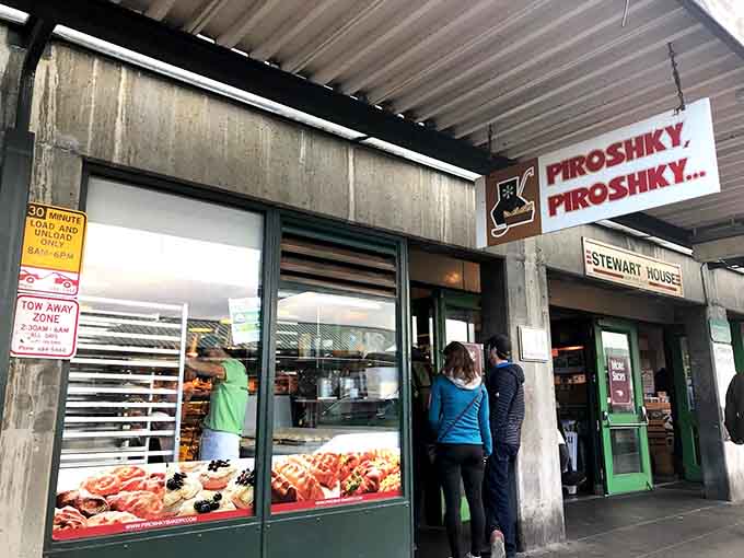 Those golden beauties lined up in the window aren't just pastries, they're edible architecture begging you to stop walking.
