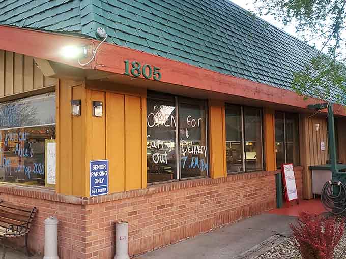 That wood-paneled exterior isn't trying to impress anyone, and that's exactly why it works so perfectly here.