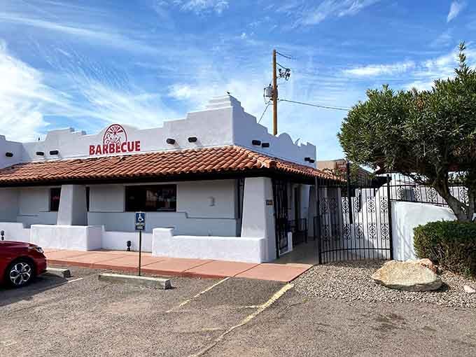 That white stucco and terra cotta tile combo says "Arizona charm" louder than a mariachi band at sunrise.