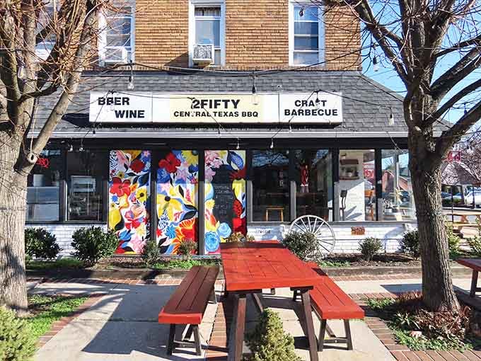 That brick facade and outdoor seating whisper promises of smoky perfection waiting just beyond those colorful windows.