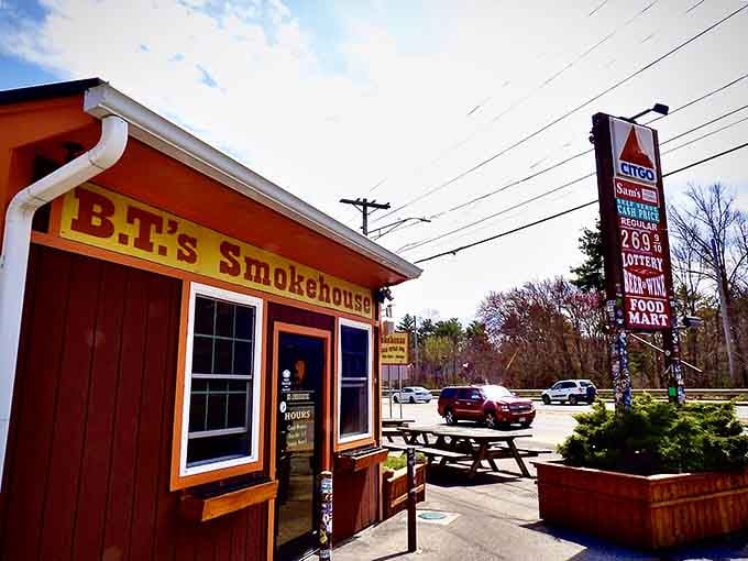 The cozy roadside setting with picnic tables ready proves that great barbecue doesn't need fancy digs, just serious smokers.