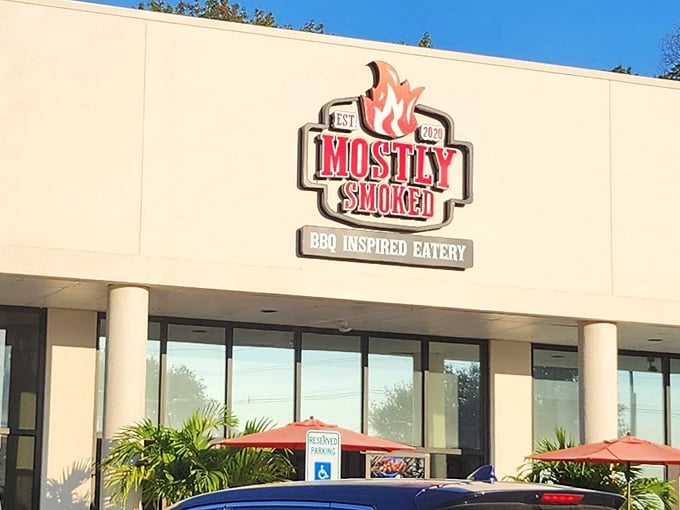 That flame logo isn't just for show, it's a promise of the smoky goodness waiting inside this Manalapan barbecue haven.