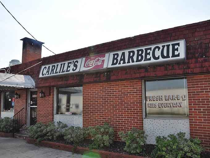 That classic Coca-Cola sign and brick facade aren't just charming, they're a promise of authentic barbecue inside.