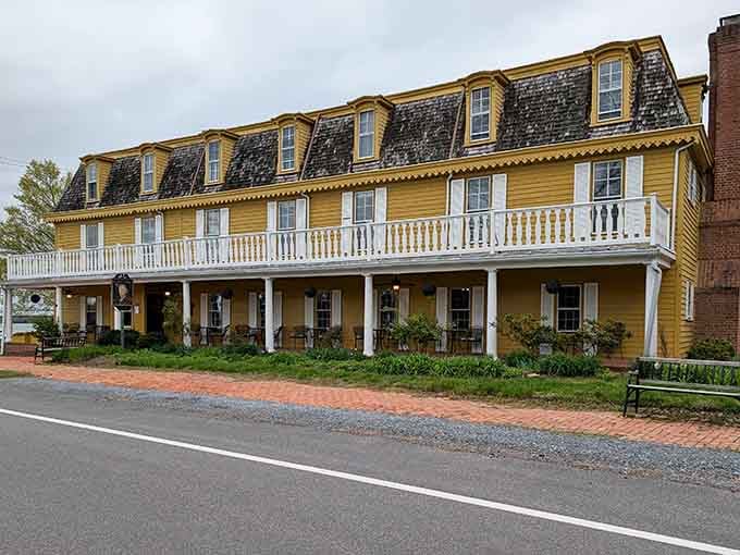 That yellow colonial facade isn't just pretty, it's been welcoming hungry travelers since America was figuring out democracy.