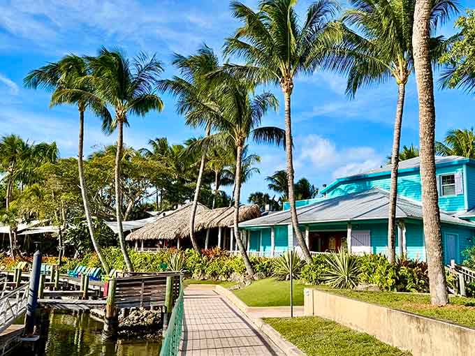 Palm trees swaying over turquoise buildings and waterfront walkways, this is Florida living at its finest.
