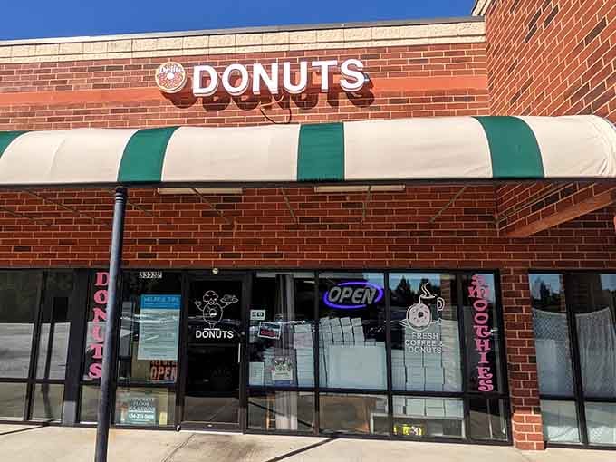 That green and white striped awning is your beacon to donut paradise in Danville, Virginia.