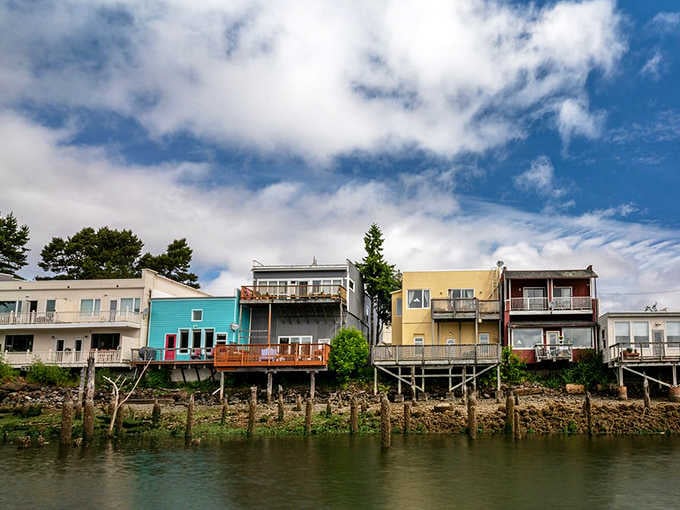 These colorful riverfront homes perch on stilts like a cheerful box of crayons came to life along the water.