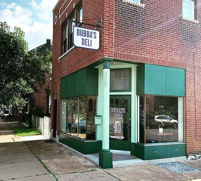 Classic brick meets retro green storefront, proving that sometimes the best food hides in the most unassuming places.