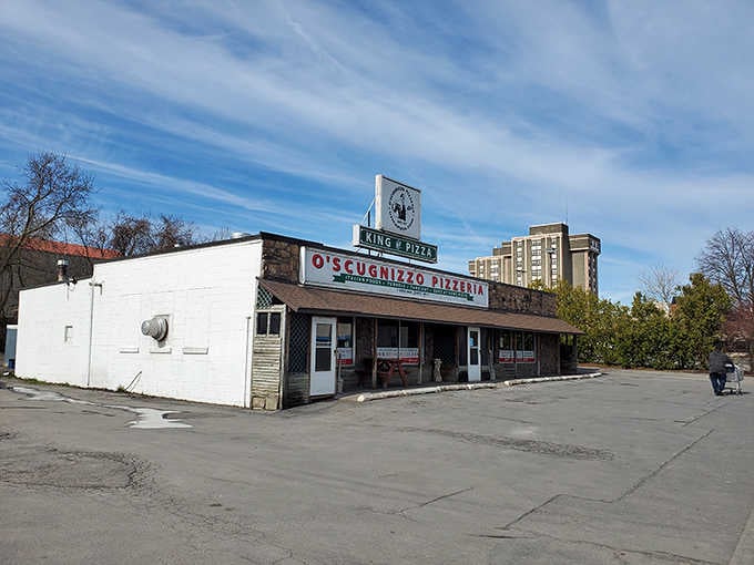 That "King of Pizza" sign isn't just bragging, it's a promise they've been keeping for generations of hungry customers.