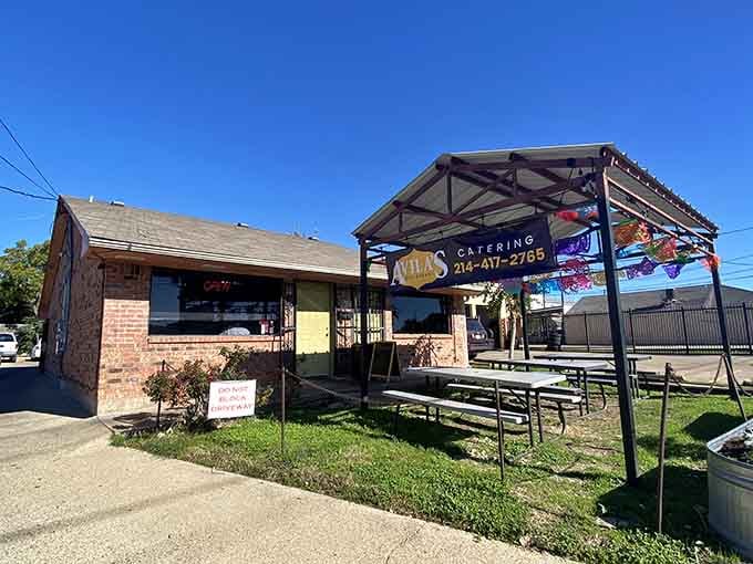 That covered patio with picnic tables promises sunshine, enchiladas, and the kind of outdoor dining that makes you forget your troubles.