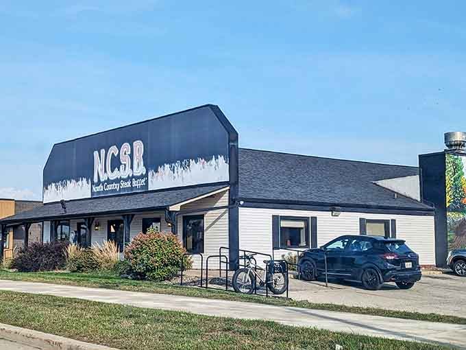 Your destination awaits behind that bold sign, where unlimited steak becomes reality and belt buckles meet their match.