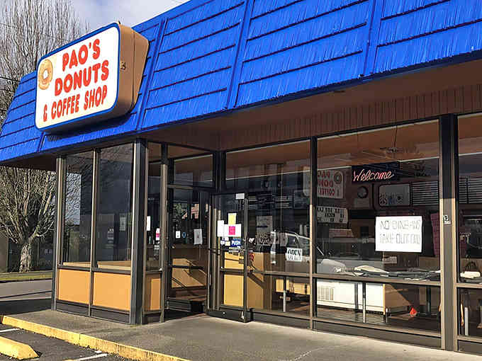 That bright blue awning shines like a beacon for anyone who knows true donut happiness awaits inside.