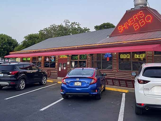 That distinctive red roof and neon glow means one thing: serious barbecue awaits inside this Homestead treasure.