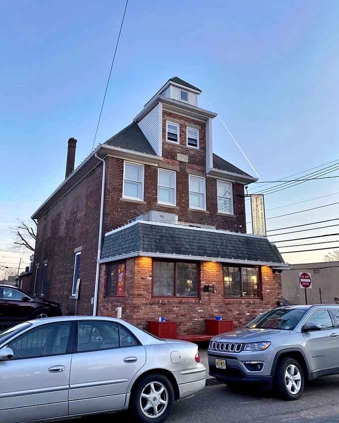That towering brick facade isn't just charming architecture, it's an actual historic firehouse turned restaurant destination.