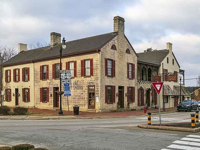 Historic stone tavern at the crossroads where Route 62 meets old-town charm and red shutters tell Kentucky stories.