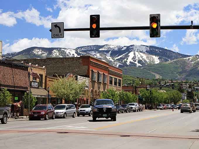 Downtown Steamboat Springs where brick buildings meet mountain peaks, and traffic lights feel almost unnecessary.