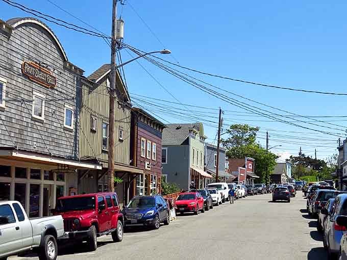 These colorful Victorian storefronts look like someone painted a rainbow and forgot to stop at the hardware store.