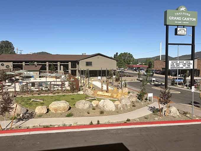 That vintage sign beckons like a siren call to weary travelers seeking adventure beyond ordinary roadside stops.