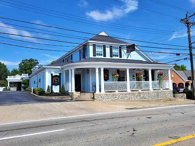 That classic white porch isn't just for show; it's your gateway to one of Kentucky's most legendary pork tenderloins.