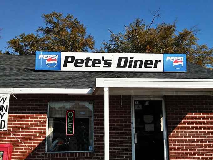 That classic Pepsi sign and brick facade aren't just decoration, they're a promise of serious comfort food ahead.